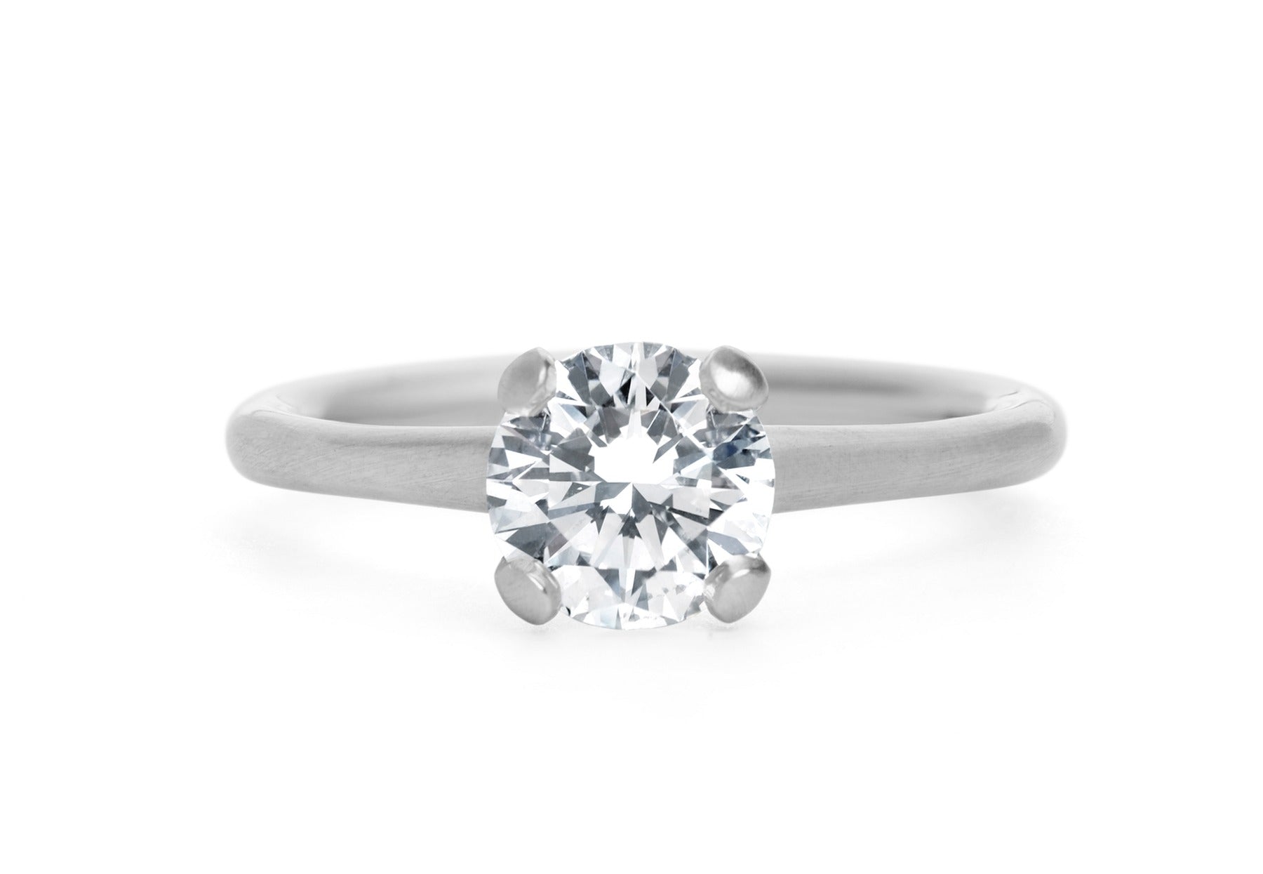 Sculpted platinum 4 claw white diamond engagement ring